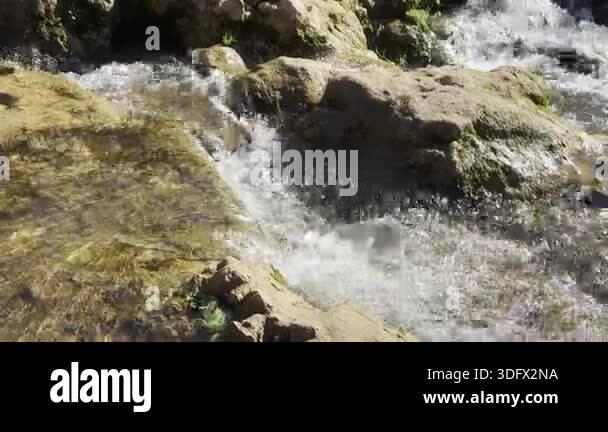 A waterfall in the heart of nature, a beautiful river and waterfall ...