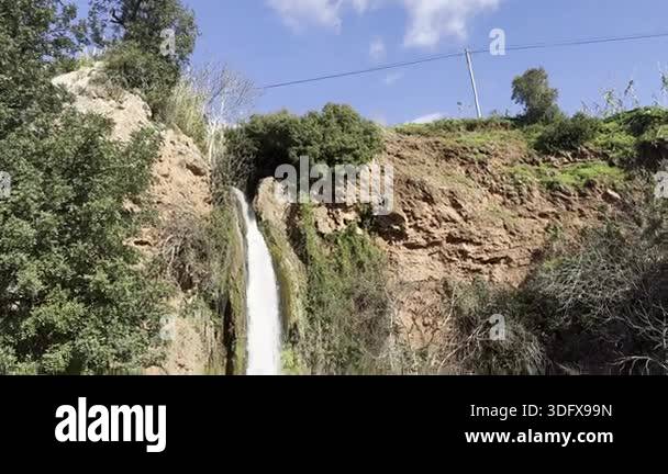 A waterfall in the heart of nature, a beautiful river and waterfall ...