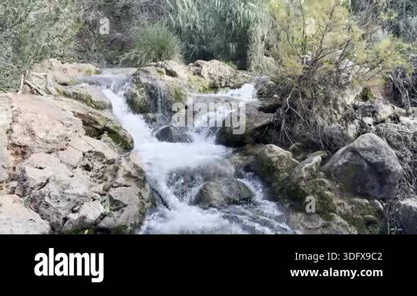 A waterfall in the heart of nature, a beautiful river and waterfall ...