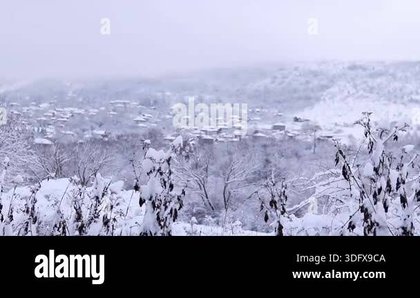 Winter landscape with snow-covered houses on the horizon. Beautiful ...