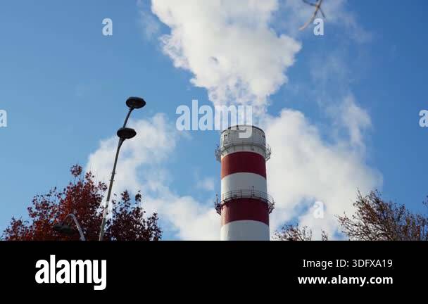 Cinematic shot of an industrial boiler house chimney releasing white ...
