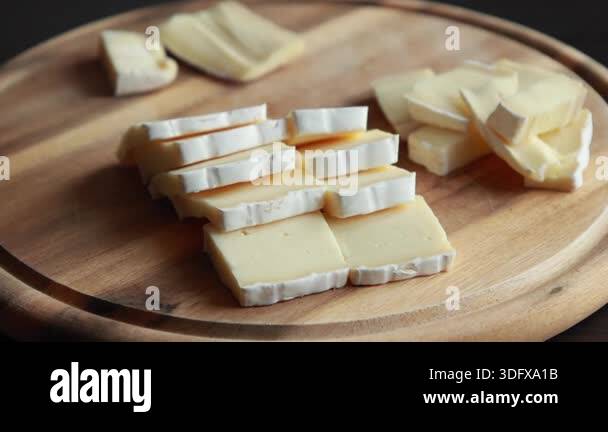 Woman Slicing Brie Cheese on Wooden Cutting Board Gourmet Appetizer ...