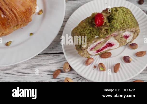 Close-up shot from video showing pistachio croissant, pistachio cake ...