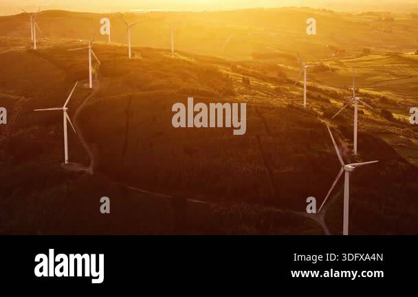 Renewable energy wind turbines at sunset. aerial view of wind turbines ...