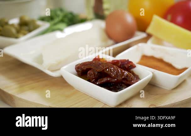 White fish fillet with fresh vegetables and greens as ingredients for ...