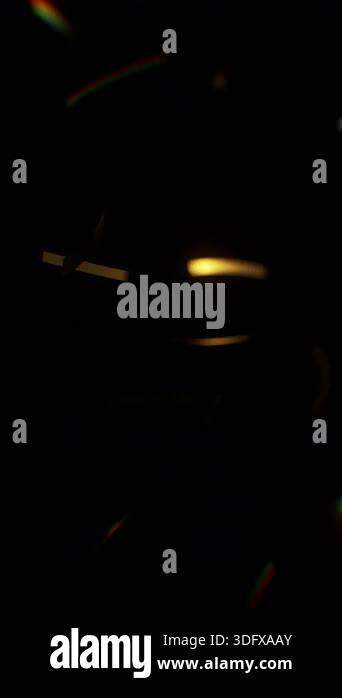 Falling Gold Confetti with soft focus rainbow color rays of light ...