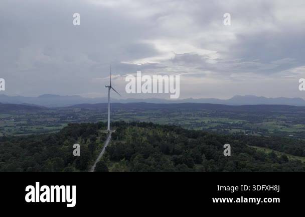 Closeup beautiful solo wind turbine at green mountain hill clean ...
