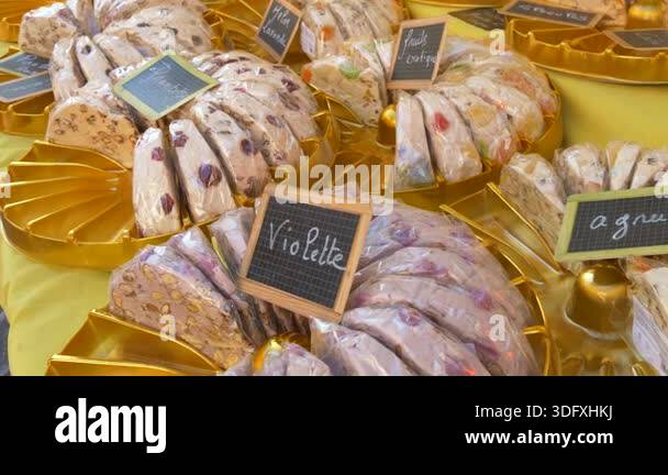 Close-up of artisanal nougat bars in different flavors violet, citrus ...