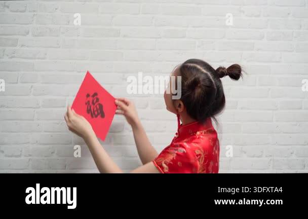 Happy young Asian woman wearing traditional red cheongsam dress ...