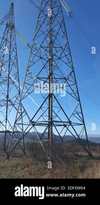 View of a tall steel lattice electricity pylon towering against the ...