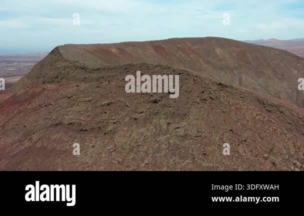Aerial drone footage of the narrow ridge leading to the peak of Montaa ...