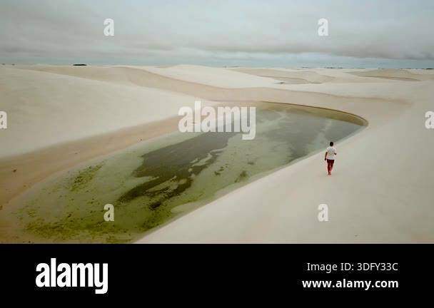 Lencois Maranhenses National Park full of dunes and lagoons. Me running ...