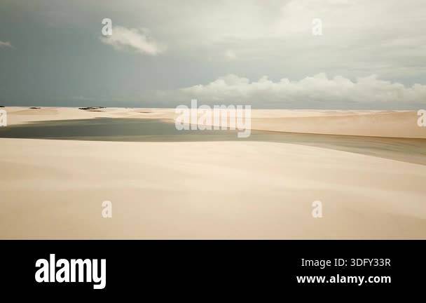 Lencois Maranhenses National Park full of dunes and lagoons. Girl ...