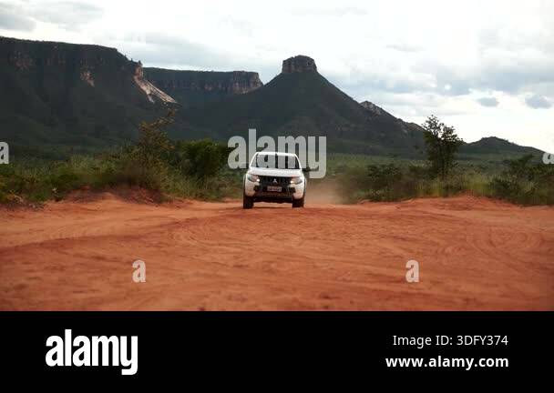 Vehicle in Jalapao national park with a table mountain in the ...
