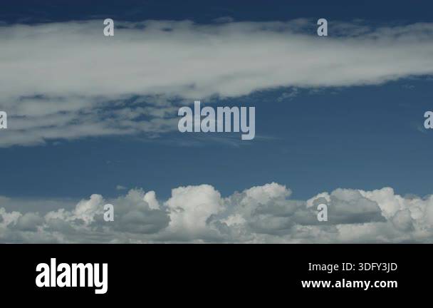 Beautiful cumulus clouds on a blue sky - time lapse video; slow ...