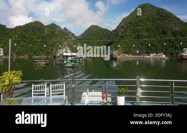 Calm water reflecting green mountains and sky Stock Video Footage - Alamy