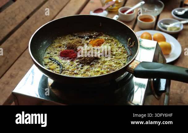 adding cumin seeds powder or jeera Stock Video Footage - Alamy