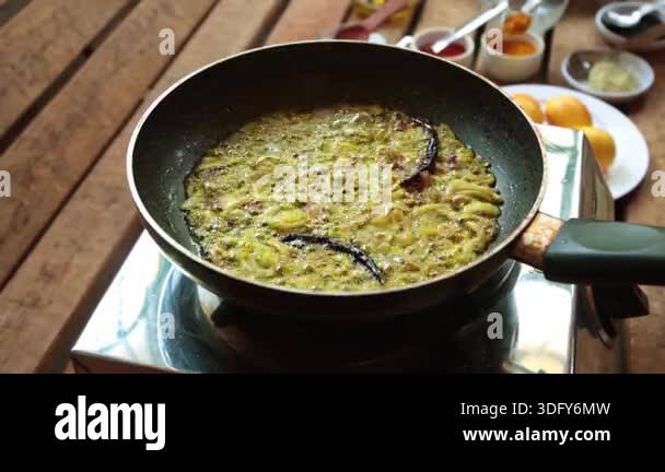 adding turmeric powder in gravy for good taste Stock Video Footage - Alamy