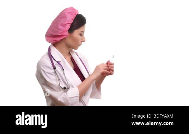 Female doctor holding a syringe isolated Stock Video Footage - Alamy