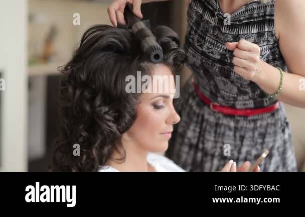 Beautiful brunette bride preparing for marriage, curly hair Stock Video ...