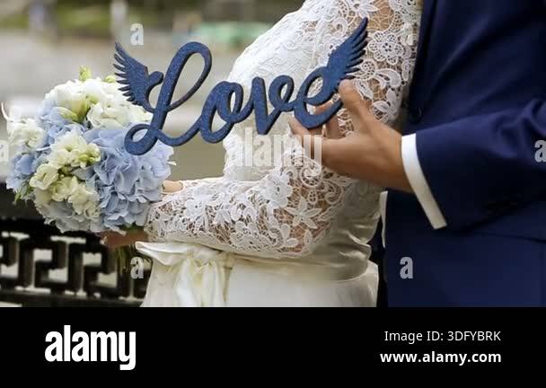 Bride and groom holding the letter the word love Stock Video Footage ...