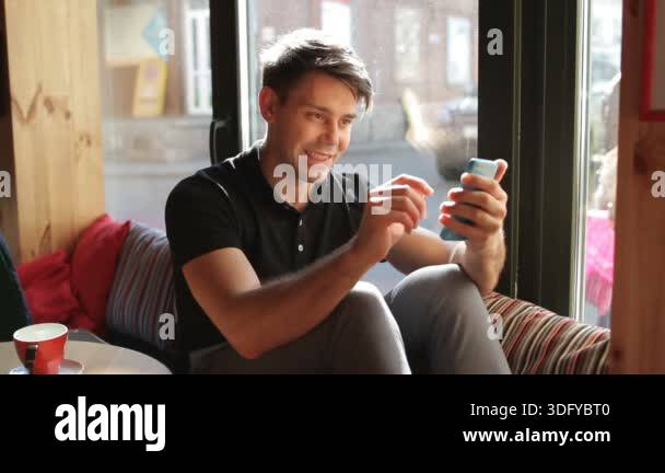 Man Drinking Coffee and surfing internet Stock Video Footage - Alamy