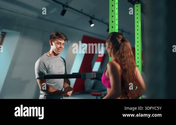 young man and personal female coach in gym Stock Video Footage - Alamy