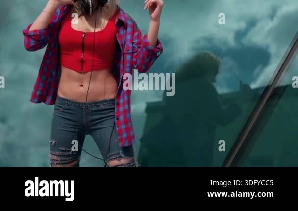 pretty girl outdoor dancing to the music Stock Video Footage - Alamy