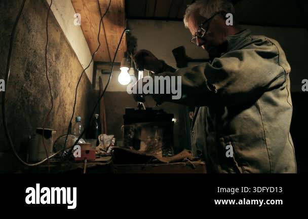 Professional car mechanic working in garage Stock Video Footage - Alamy