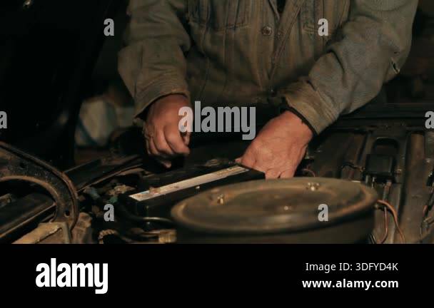 Professional car mechanic working in his garage Stock Video Footage - Alamy