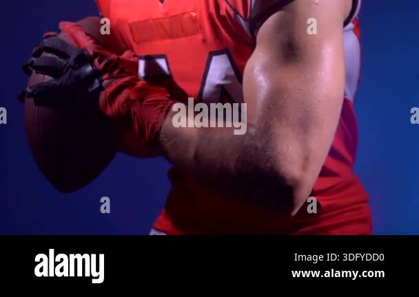 Muscular American football player training with ball Stock Video ...
