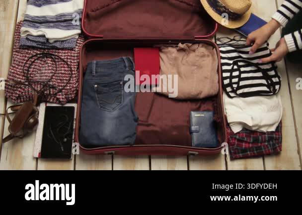Packing a suitcase for a trip Stock Video Footage - Alamy