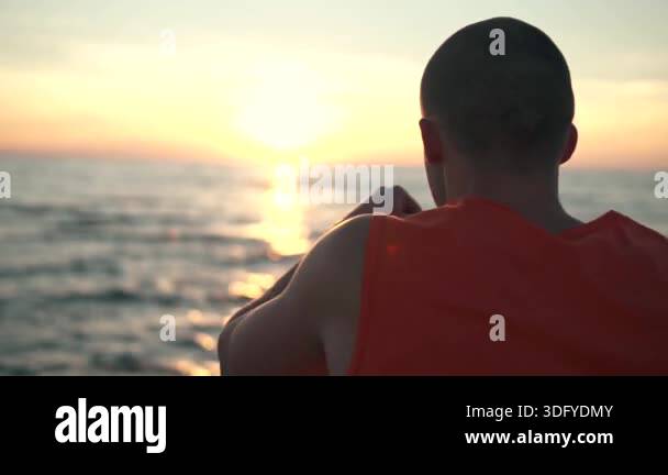 handsome man boxing at sunset at the beach Stock Video Footage - Alamy
