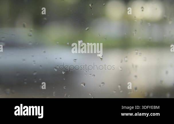 raindrops on window glass Stock Video Footage - Alamy