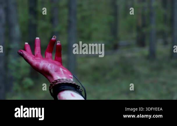 waving bloody hand Stock Video Footage - Alamy