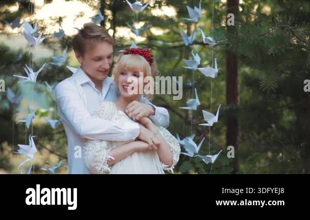 couple kissing between white soaring birds Stock Video Footage - Alamy