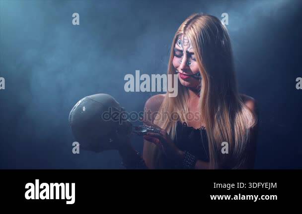 Woman spider and skull with Halloween face art Stock Video Footage - Alamy