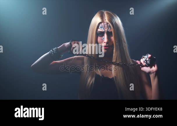 Young woman spider with Halloween face art Stock Video Footage - Alamy