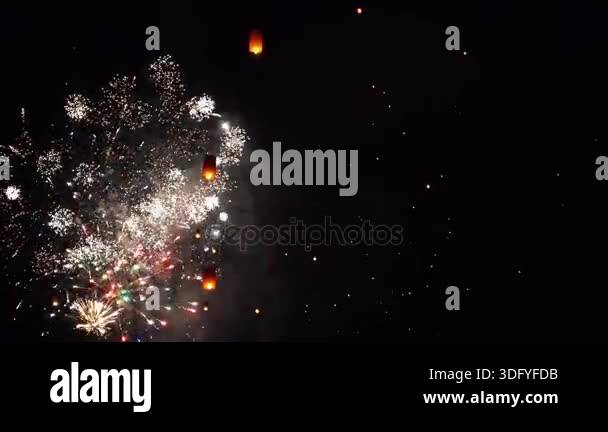 Chinese lantern flies up and fireworks in sky Stock Video Footage - Alamy