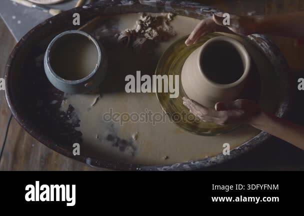 Couple making jar on potters wheel Stock Video Footage - Alamy