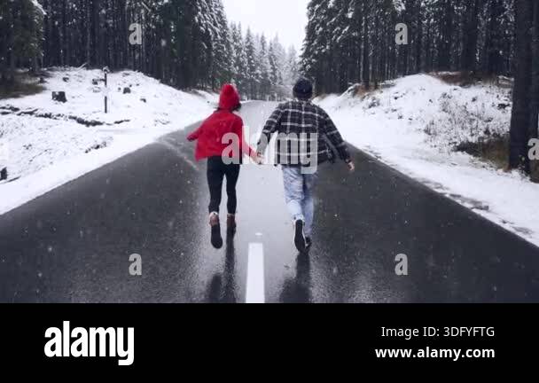 Happy winter couple running though the winter forest Stock Video ...