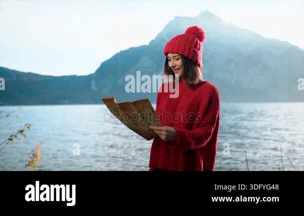 A girl with a map in the background of mountains Stock Video Footage ...