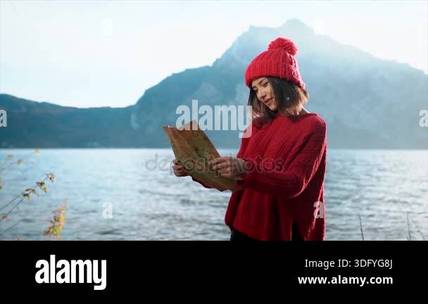 A pretty girl with a map in the mountains Stock Video Footage - Alamy