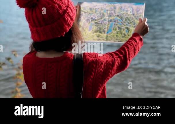 A girl looking at the map in the mountains Stock Video Footage - Alamy