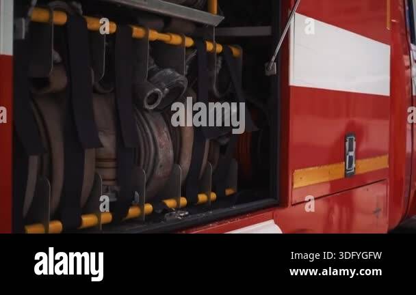 red rolls of fire hoses on red background Stock Video Footage - Alamy
