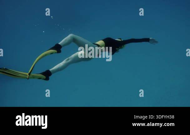 A young woman free diving underwater Stock Video Footage - Alamy