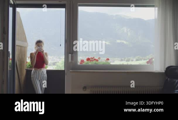 Girl with coffee enjoy landscape through the window Stock Video Footage ...