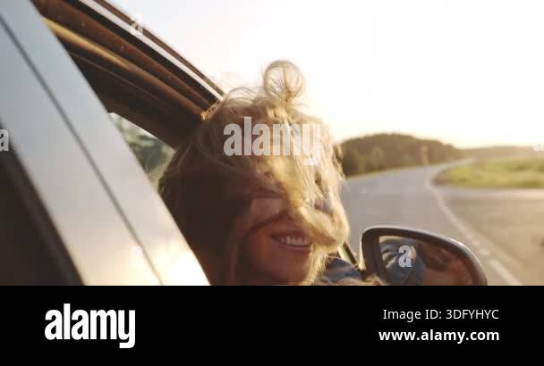 Happy Hispanic Teen Girl Rides In The Back Of Convertible, Raises Arm ...