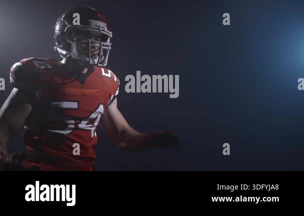 Determined professional American football player in helmet isolated ...