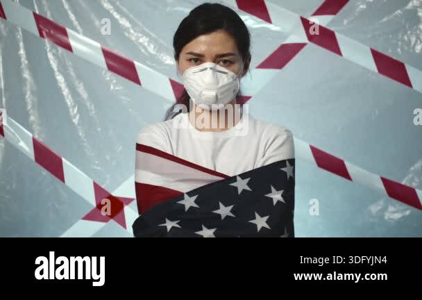 Asian woman in a medical mask wearing usa flag. Spread and statistics ...